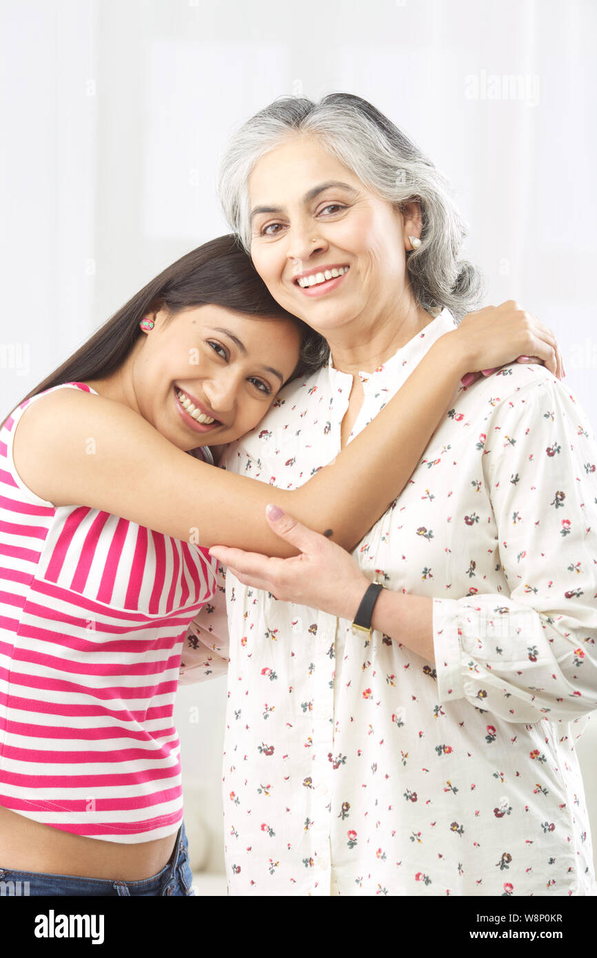 Indian mother and daughter hugging hi-res stock photography and images - Alamy