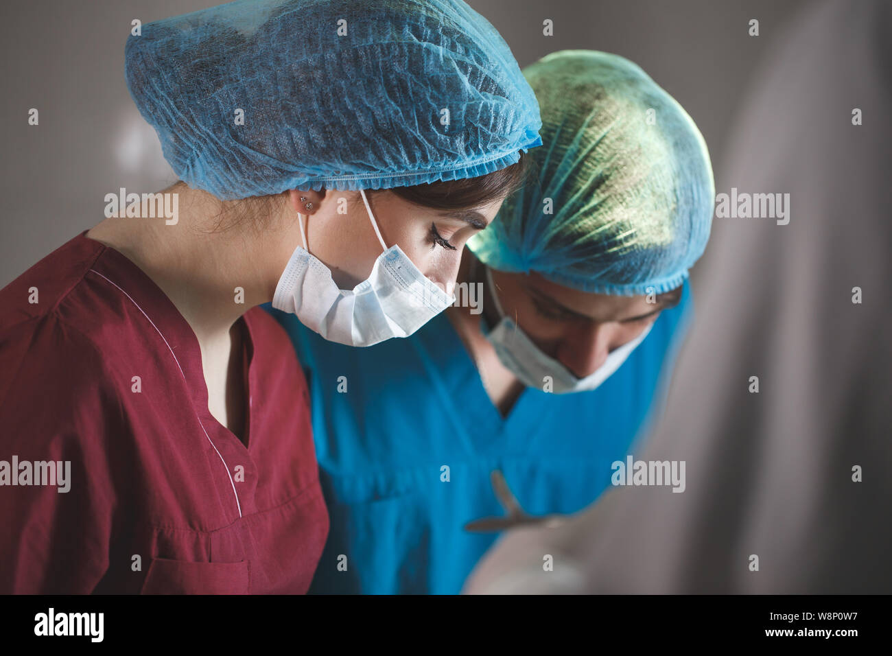 Portrait of surgeons at work, operating in uniform Stock Photo - Alamy