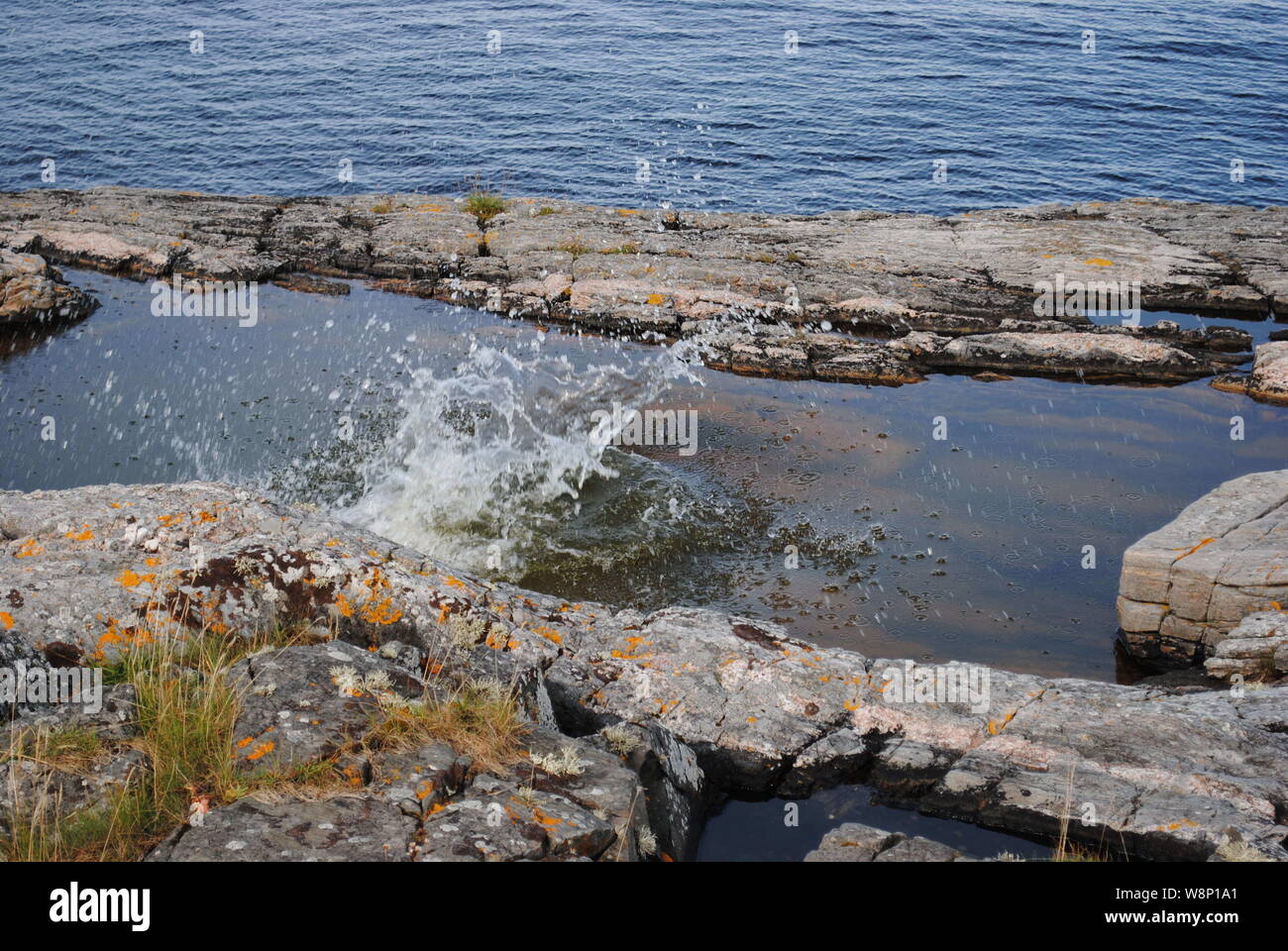 Water splashing in front of the sea Stock Photo - Alamy