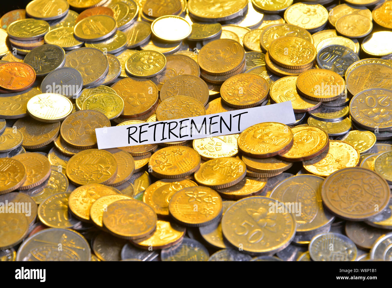 The word Retirement with stacked coins Stock Photo - Alamy