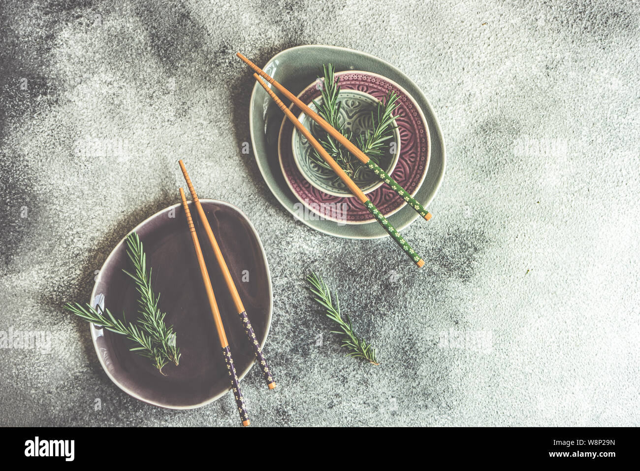 Asian style table setting with chopsticks on grey background with copy ...