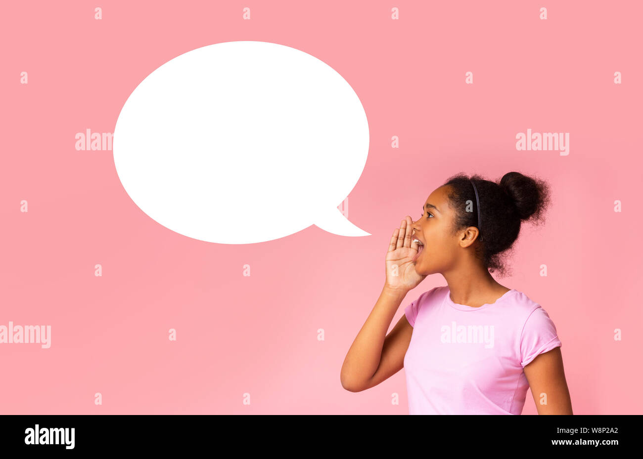 African American girl making announcement at white blank speech bubble ...