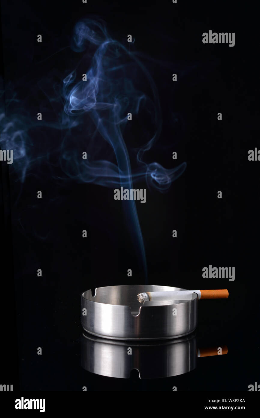 Cigarette smoke is rising hi-res stock photography and images - Alamy