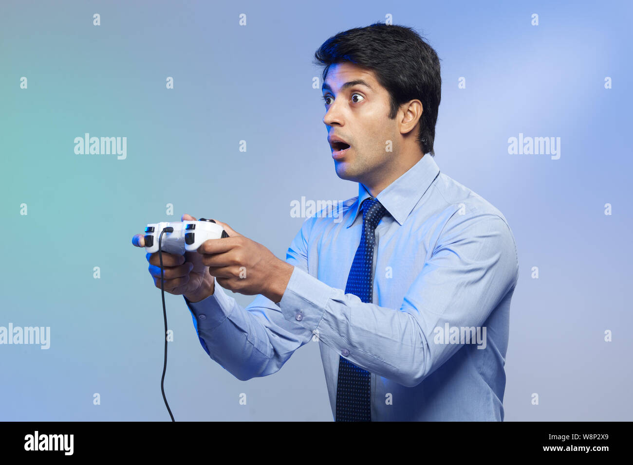 Businessman playing video game Stock Photo - Alamy