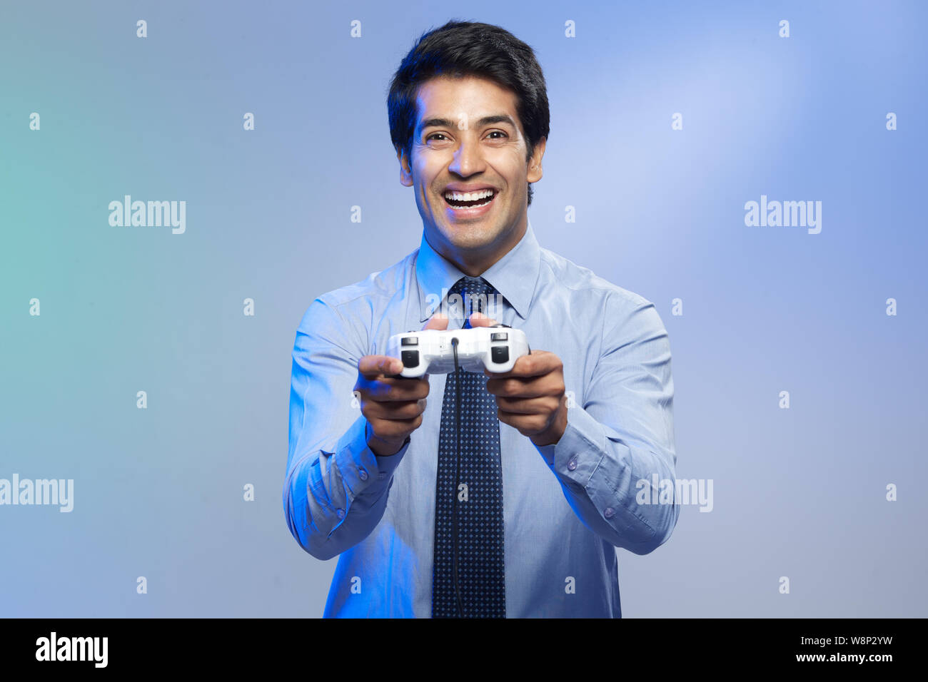 Businessman playing video game Stock Photo - Alamy
