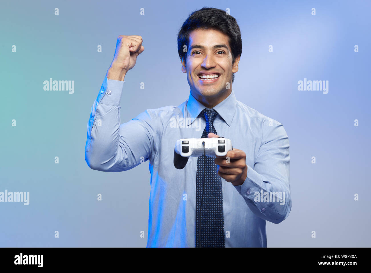 Businessman playing video game Stock Photo - Alamy