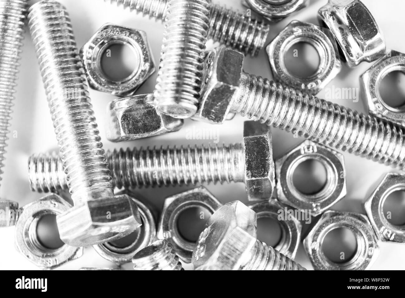 Metal bolts and nuts in a row background. Chromed screw bolts and nuts ...