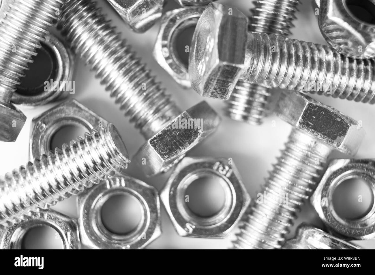 Metal bolts and nuts in a row background. Chromed screw bolts and nuts ...