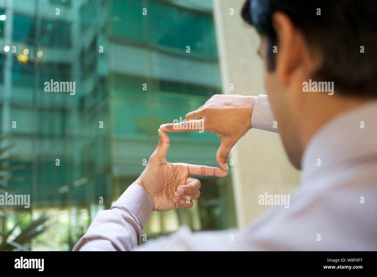 Man hands framing office Stock Photo - Alamy