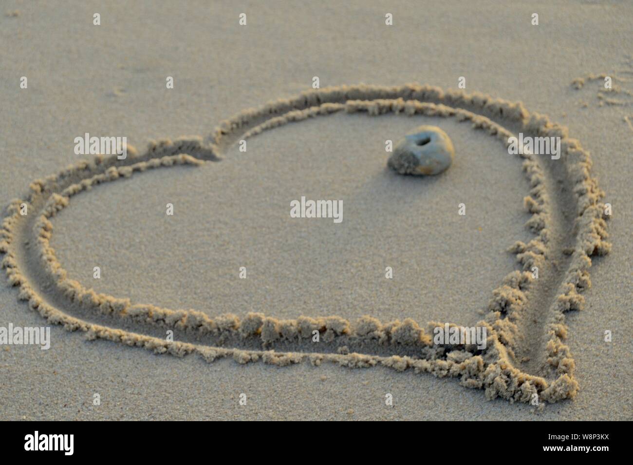 Romance sand heart hi-res stock photography and images - Alamy