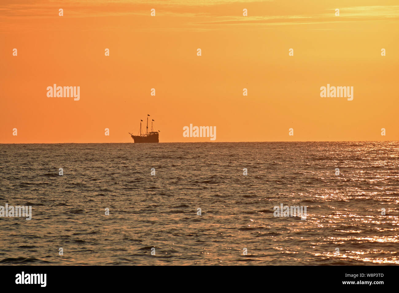Sailboats at Sunset Stock Photo - Alamy