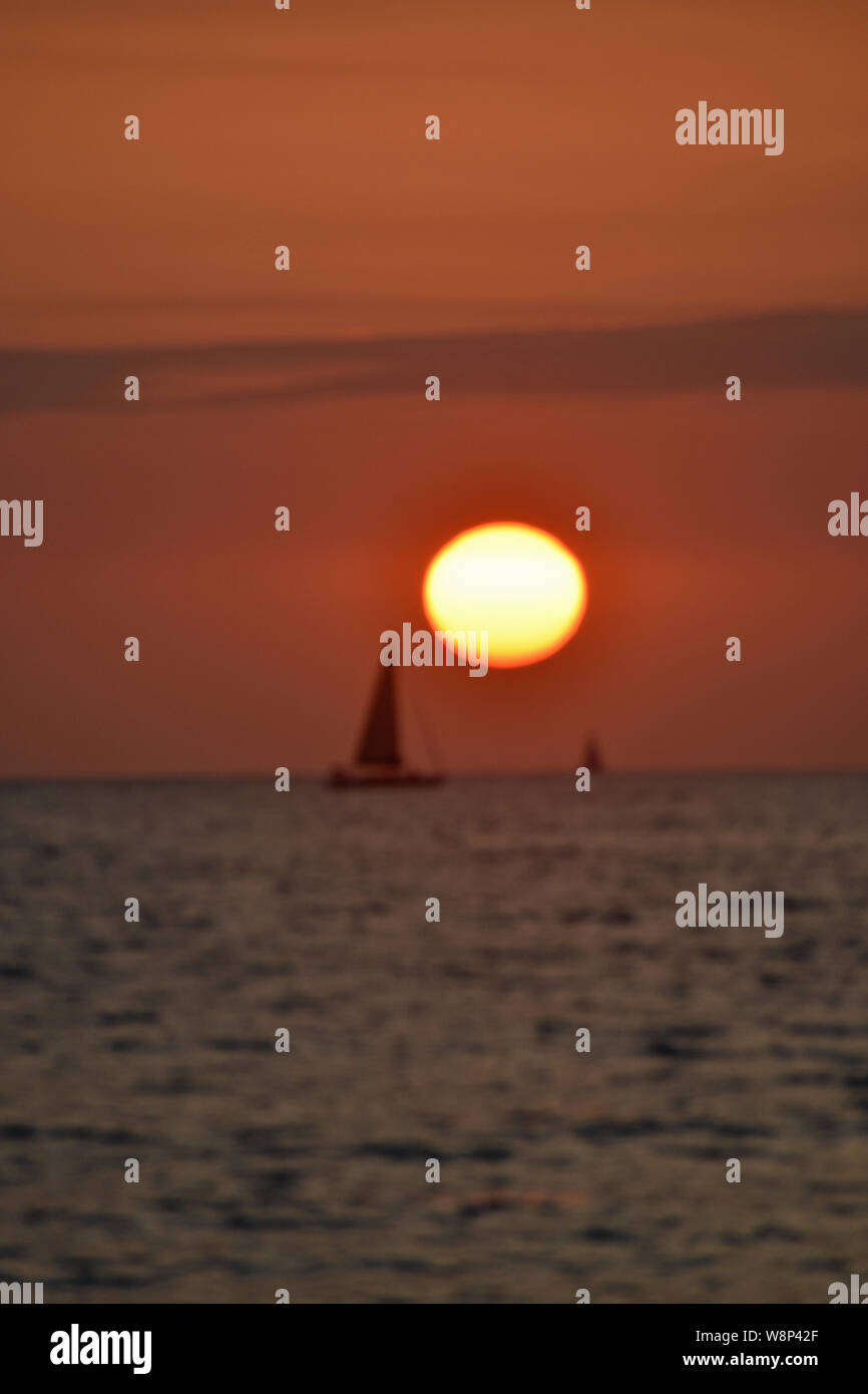 Sailboats at Sunset Stock Photo - Alamy