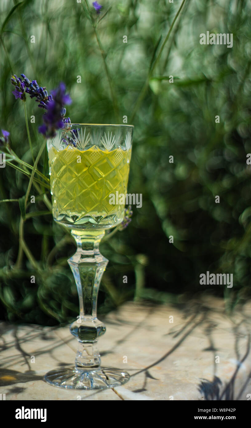 Traditional italian lemon alcohol drink limoncello with lavender ...