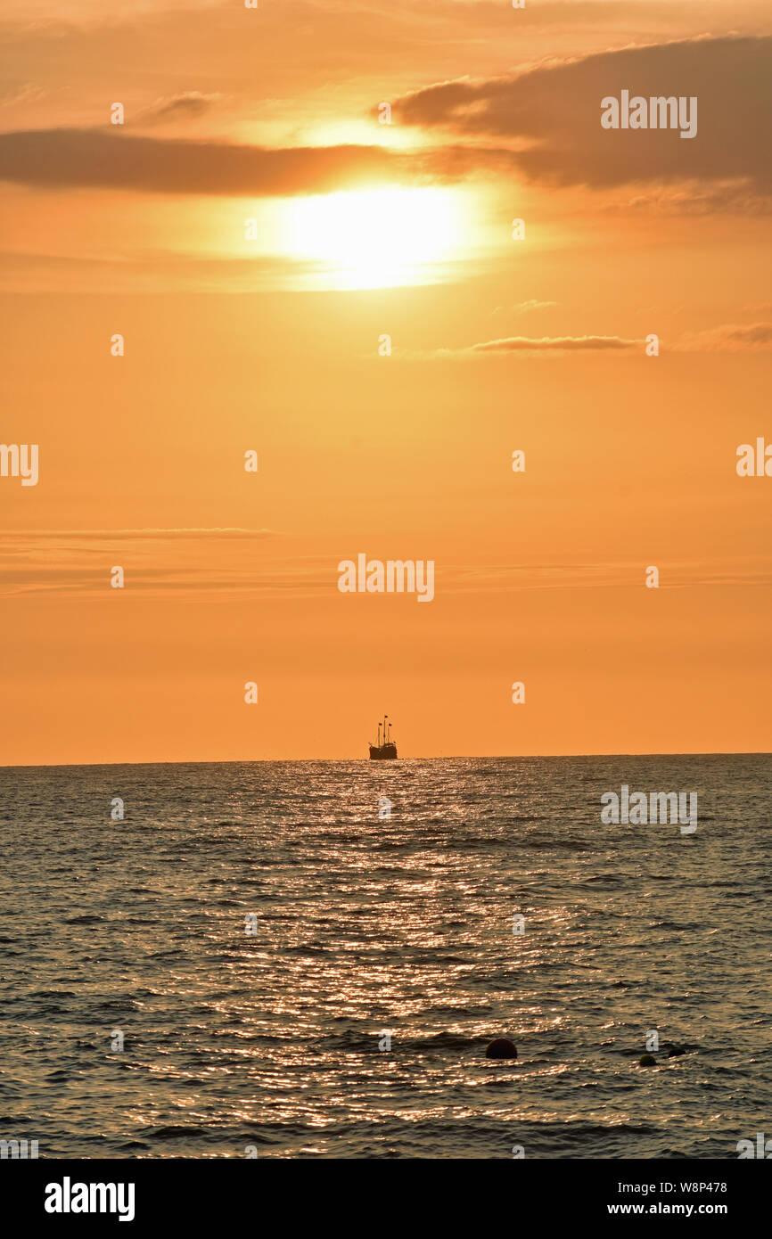 Sailboats at Sunset Stock Photo - Alamy