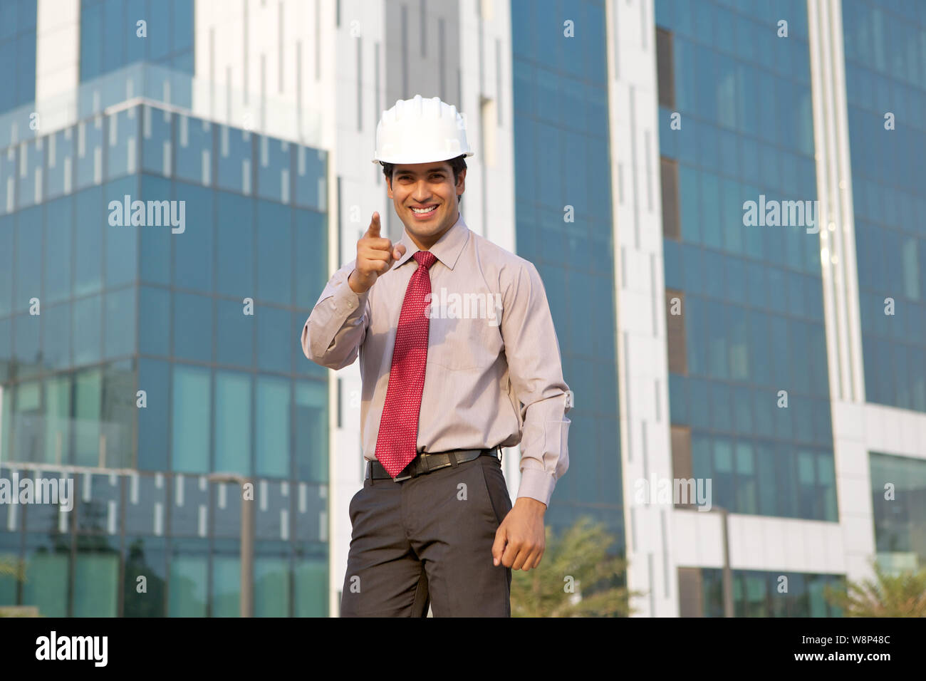 Architect standing and pointing Stock Photo - Alamy