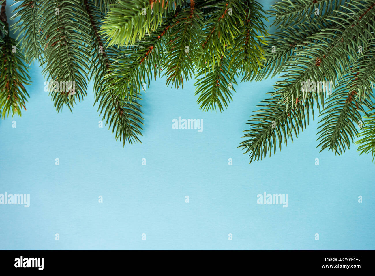 Christmas festive frame concept on blue background with copy space ...