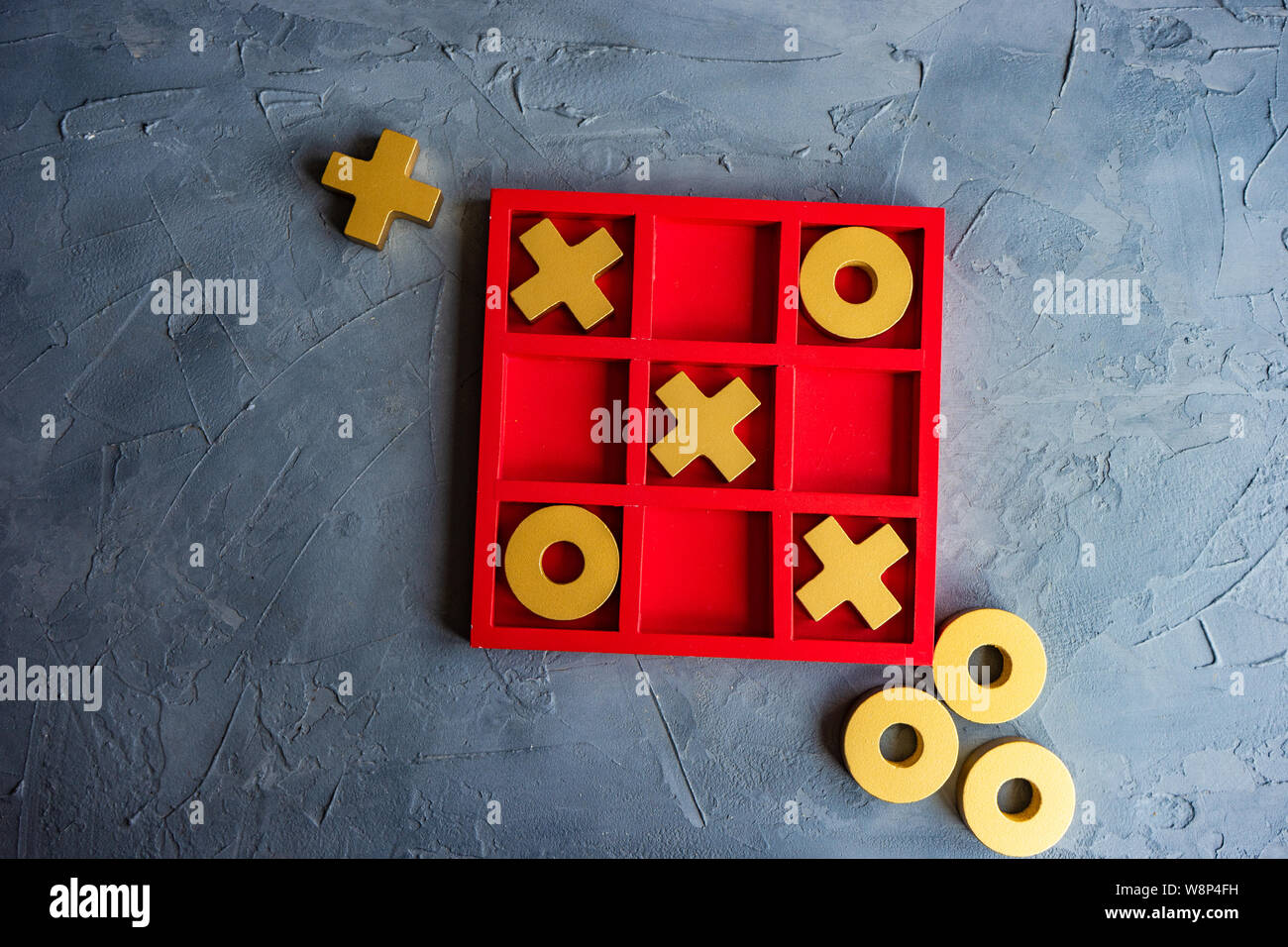 Kid tic-tac-toe board game concept on concrete background with copy ...