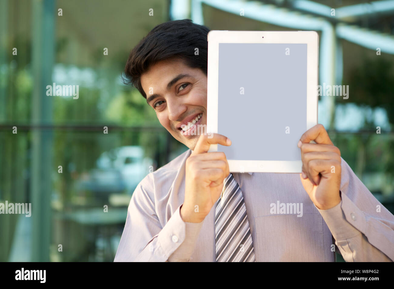 Salesman showing a digital tablet Stock Photo - Alamy