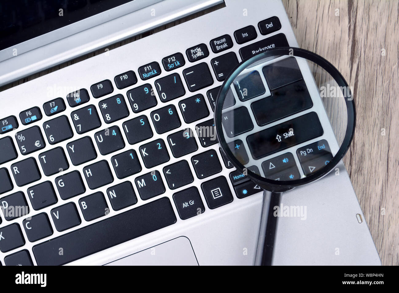 Laptop computer with magnifying glass, concept of search Stock Photo ...