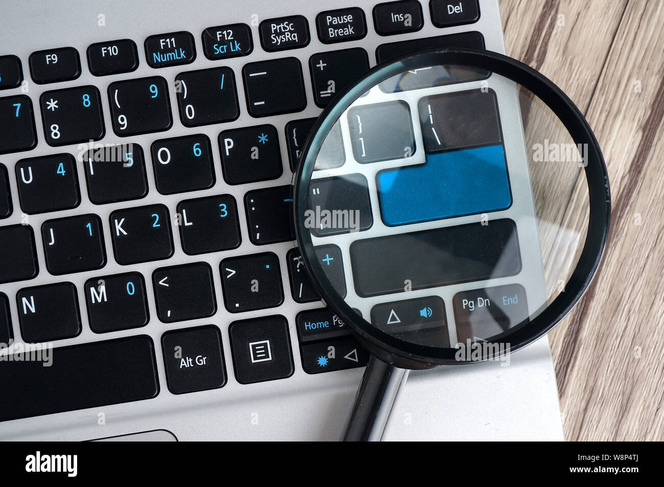 Laptop computer with magnifying glass, concept of search Stock Photo ...