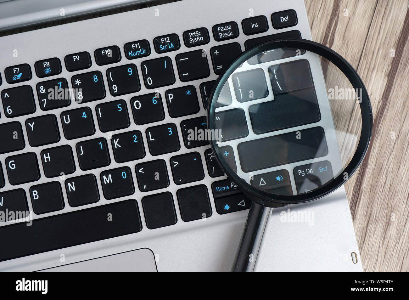 Laptop computer with magnifying glass, concept of search Stock Photo ...
