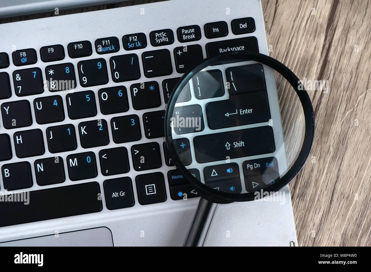 Laptop computer with magnifying glass, concept of search Stock Photo ...