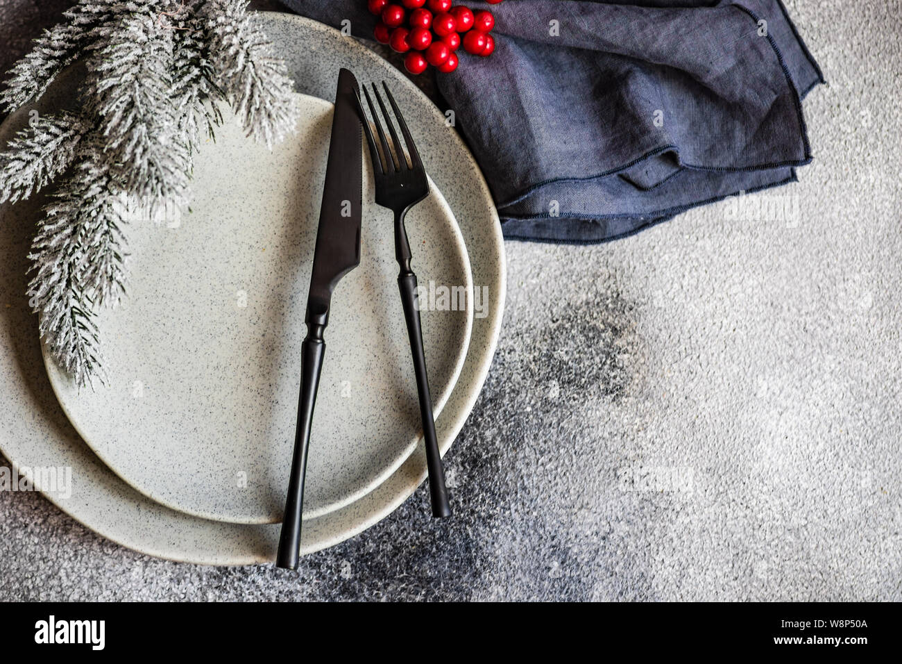 Rustic table setting for holiday Christmas dinner on grey stone ...