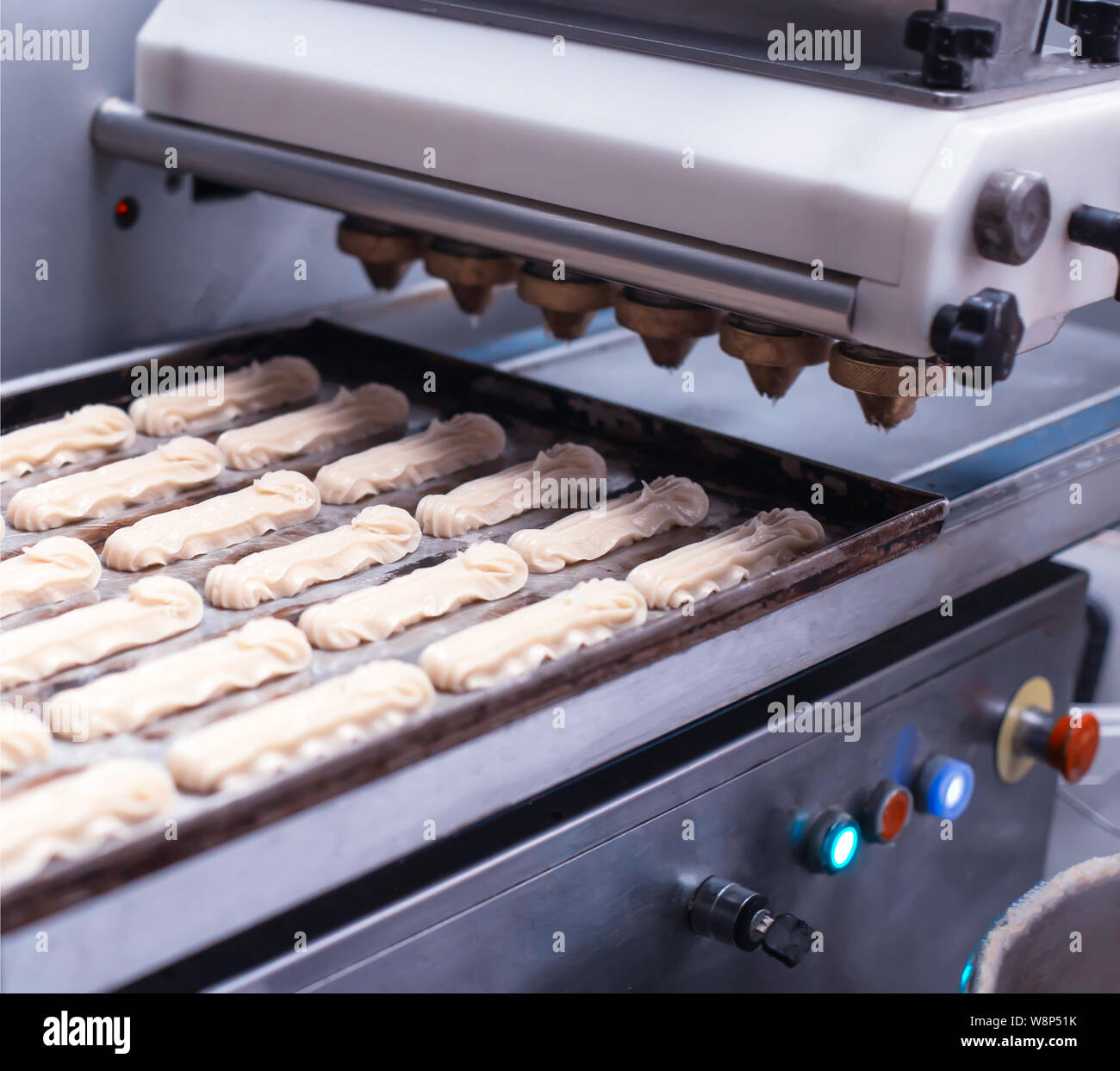 Automatic line for the production of eclairs. Eclair Cake Dough Baking ...