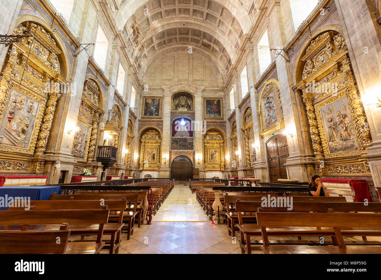 Faithful praying in Monastery of Santa Clara a Nova (Saint Clare ...