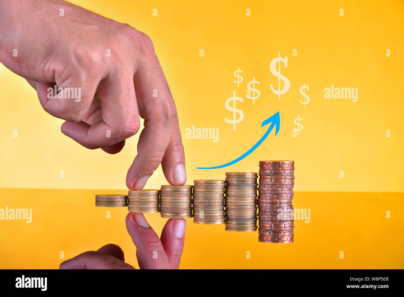 Coins stand vertically in columns ascending,revenue growth concept ...