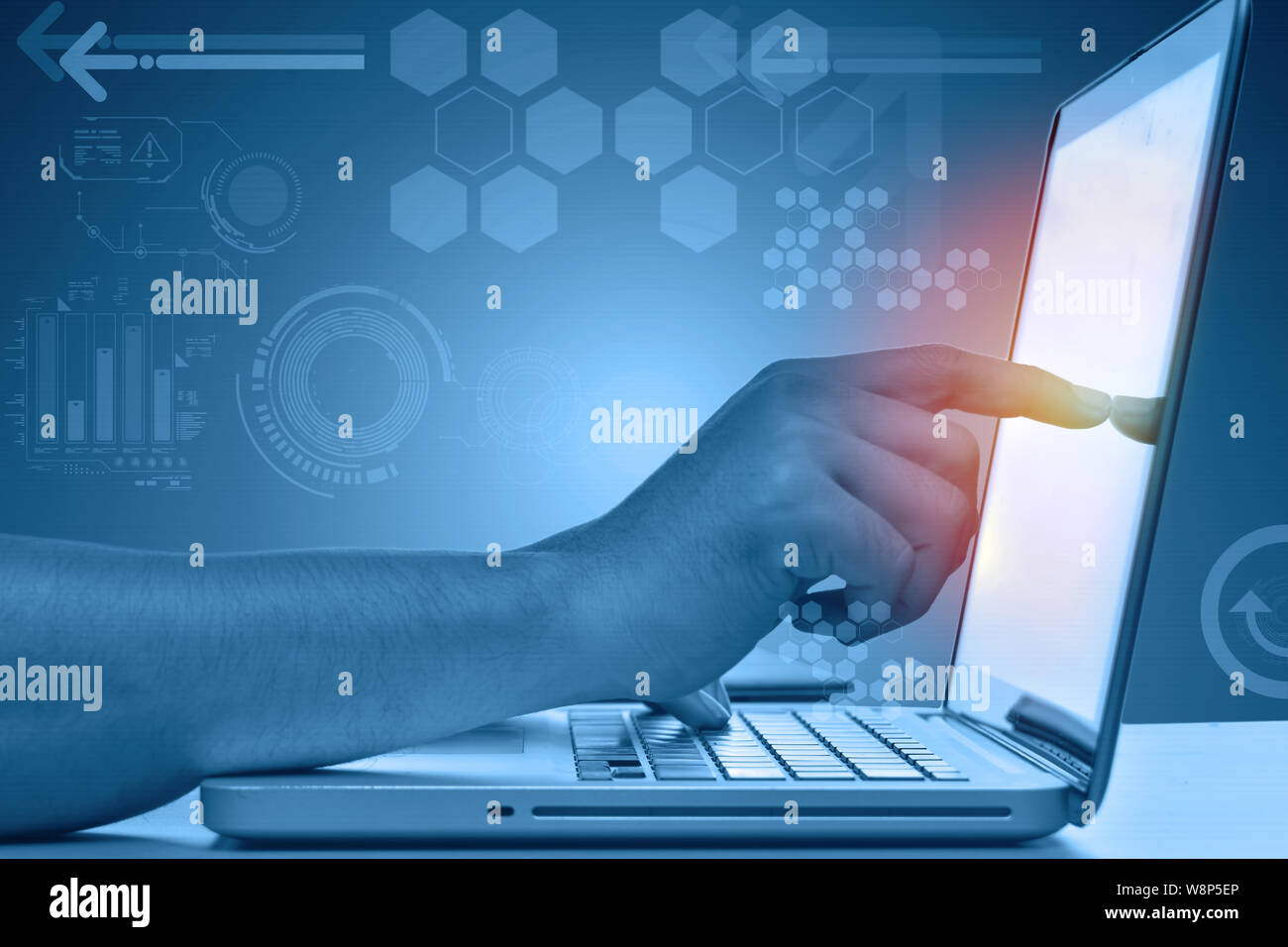 Finger touching screen of laptop Stock Photo - Alamy