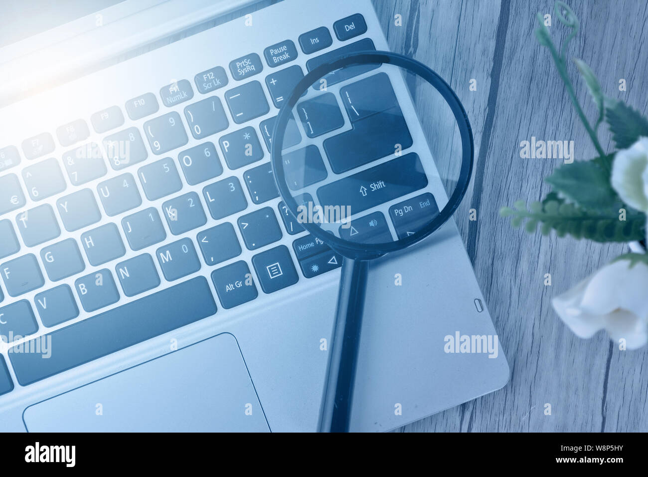 Laptop computer with magnifying glass, concept of search Stock Photo ...