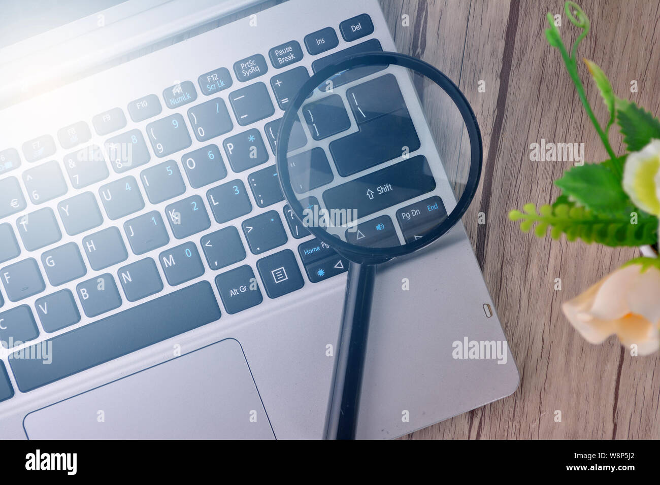 Laptop computer with magnifying glass, concept of search Stock Photo ...