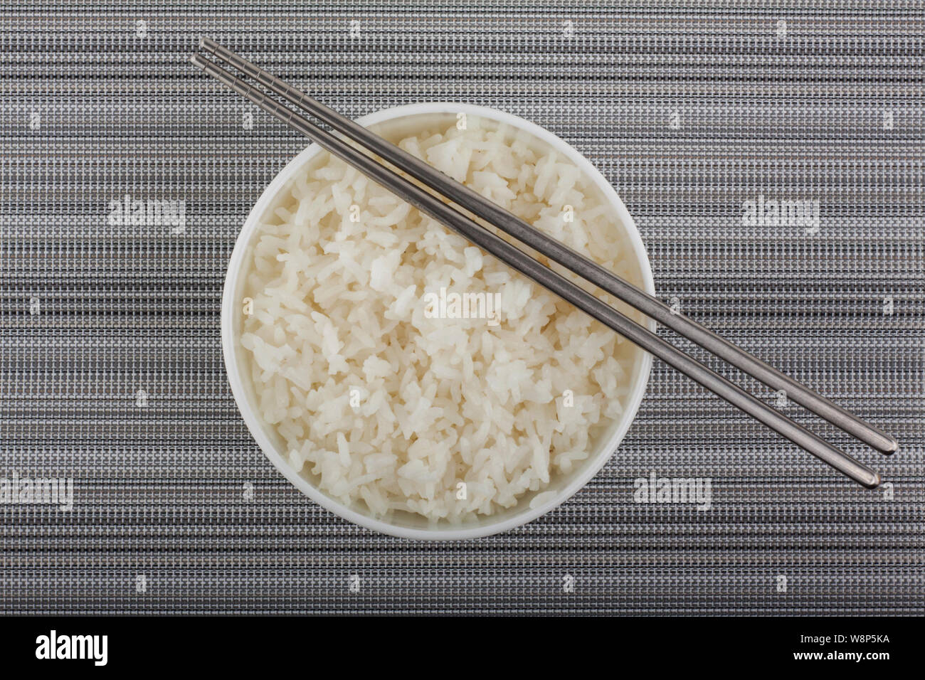 Bowl of rice with chopsticks isolated on white background Stock Photo ...