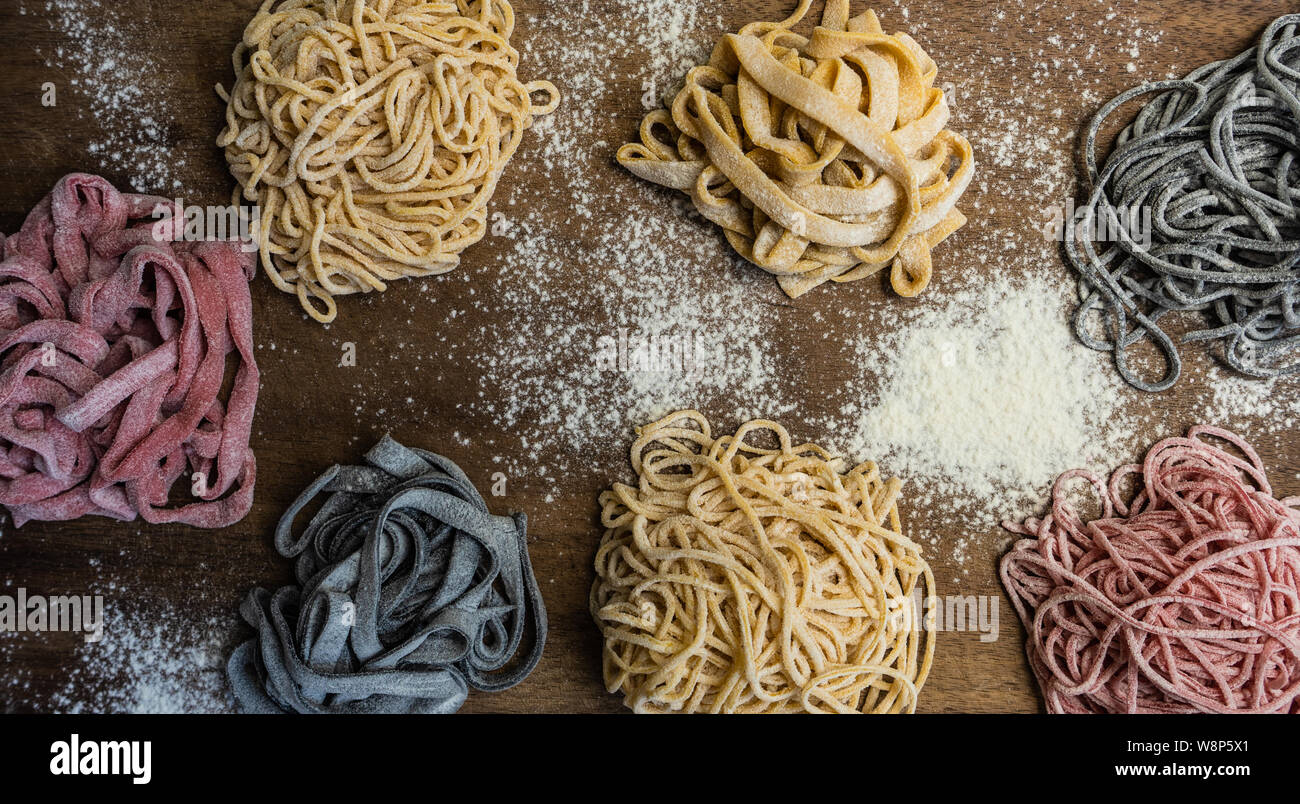 Cooking concept with italian homemade pasta variety on concrete ...