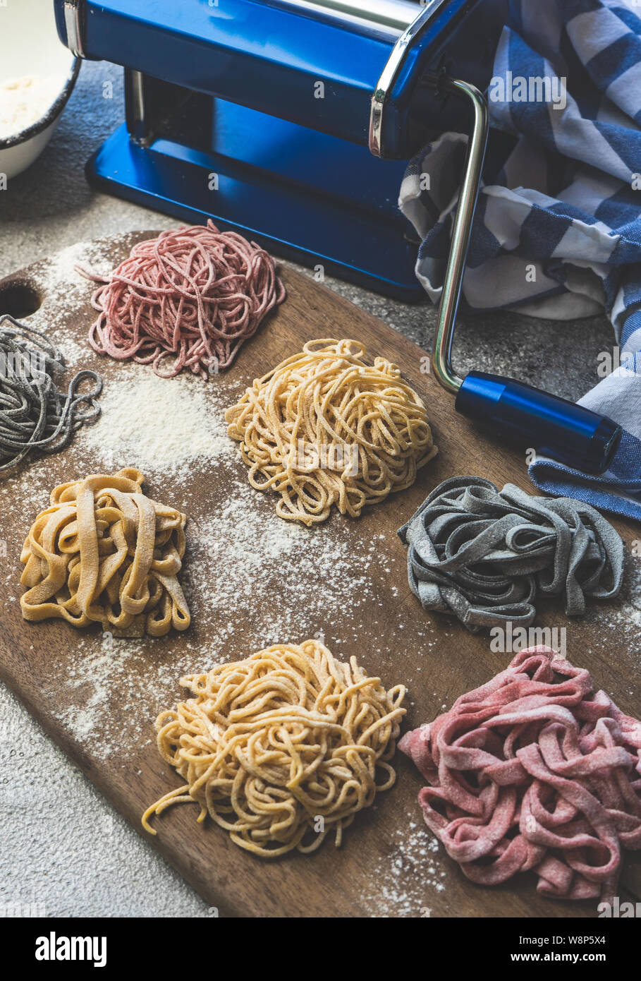 Cooking concept with italian homemade pasta variety on concrete ...