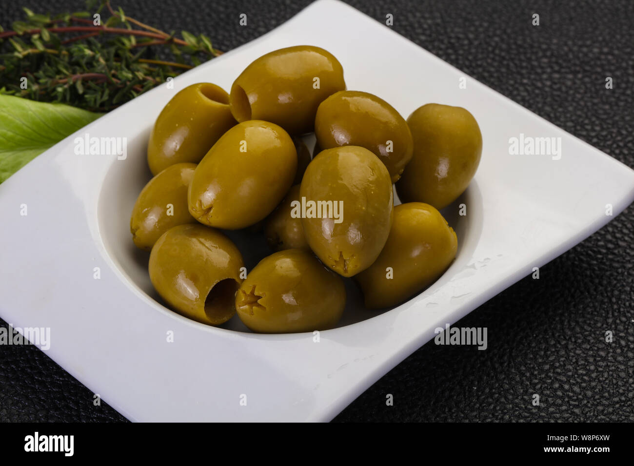 Big green olives in the bowl Stock Photo - Alamy