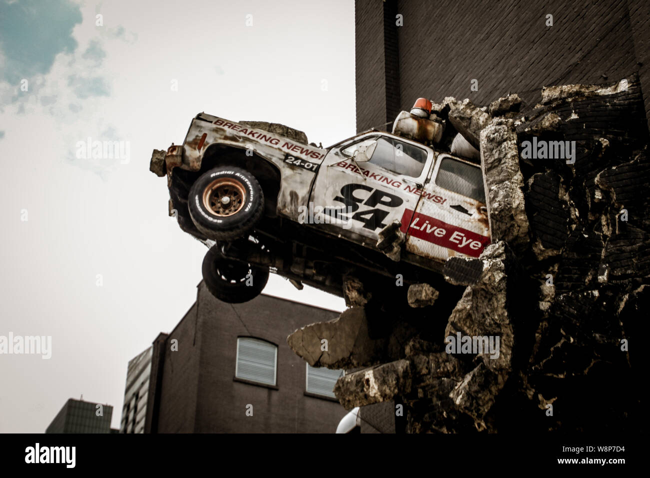 Half a car stuck in a wall in downtown Toronto, Canada Stock Photo - Alamy