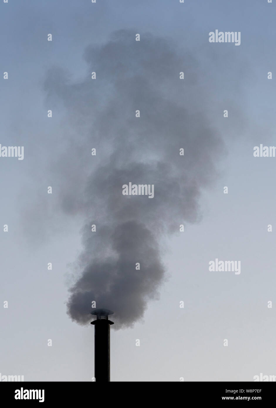 Smoke billowing out of a chimney of a bio-fuel incinerator. North ...