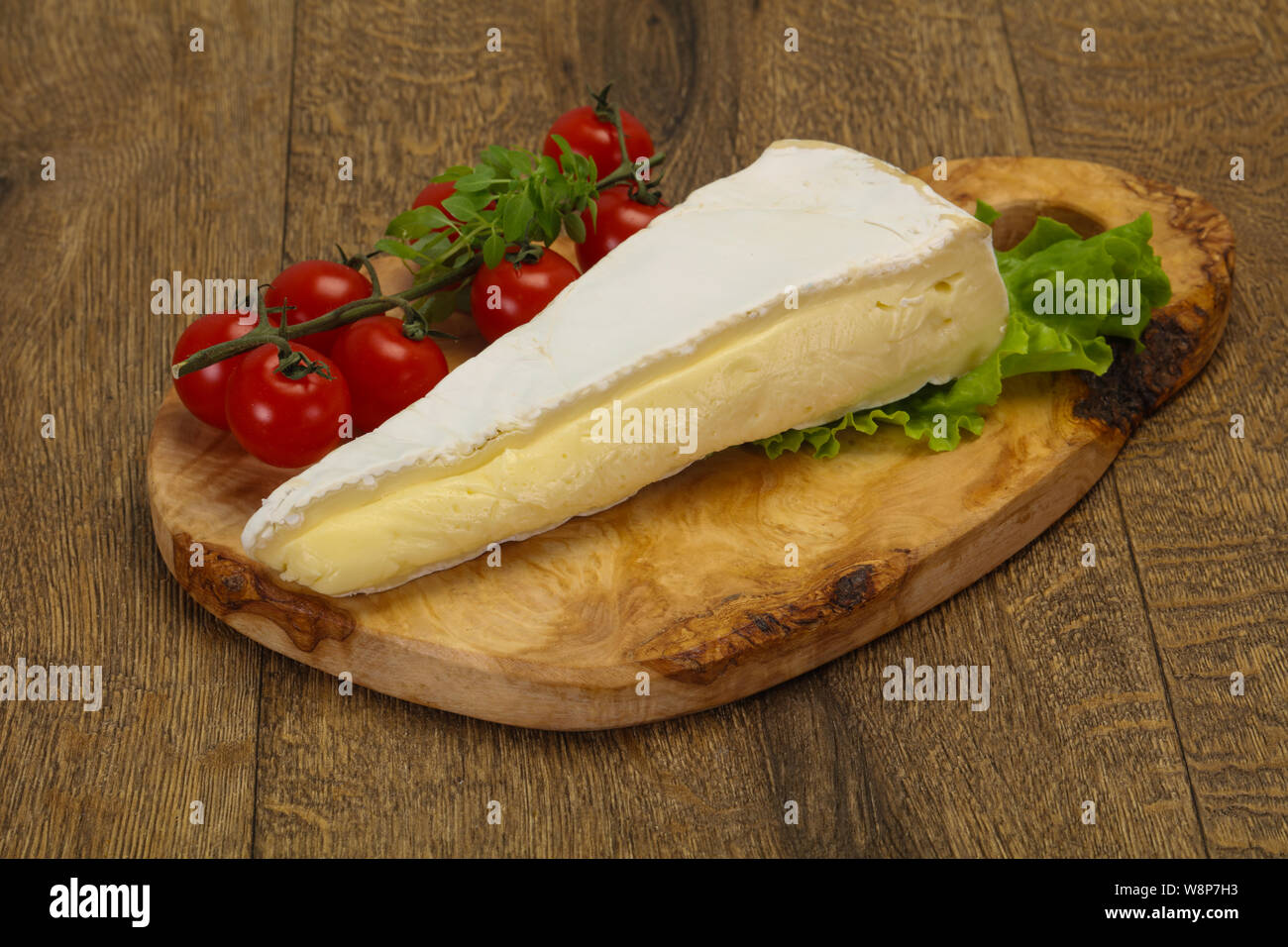 Brie cheese triangle served salad leaves Stock Photo - Alamy