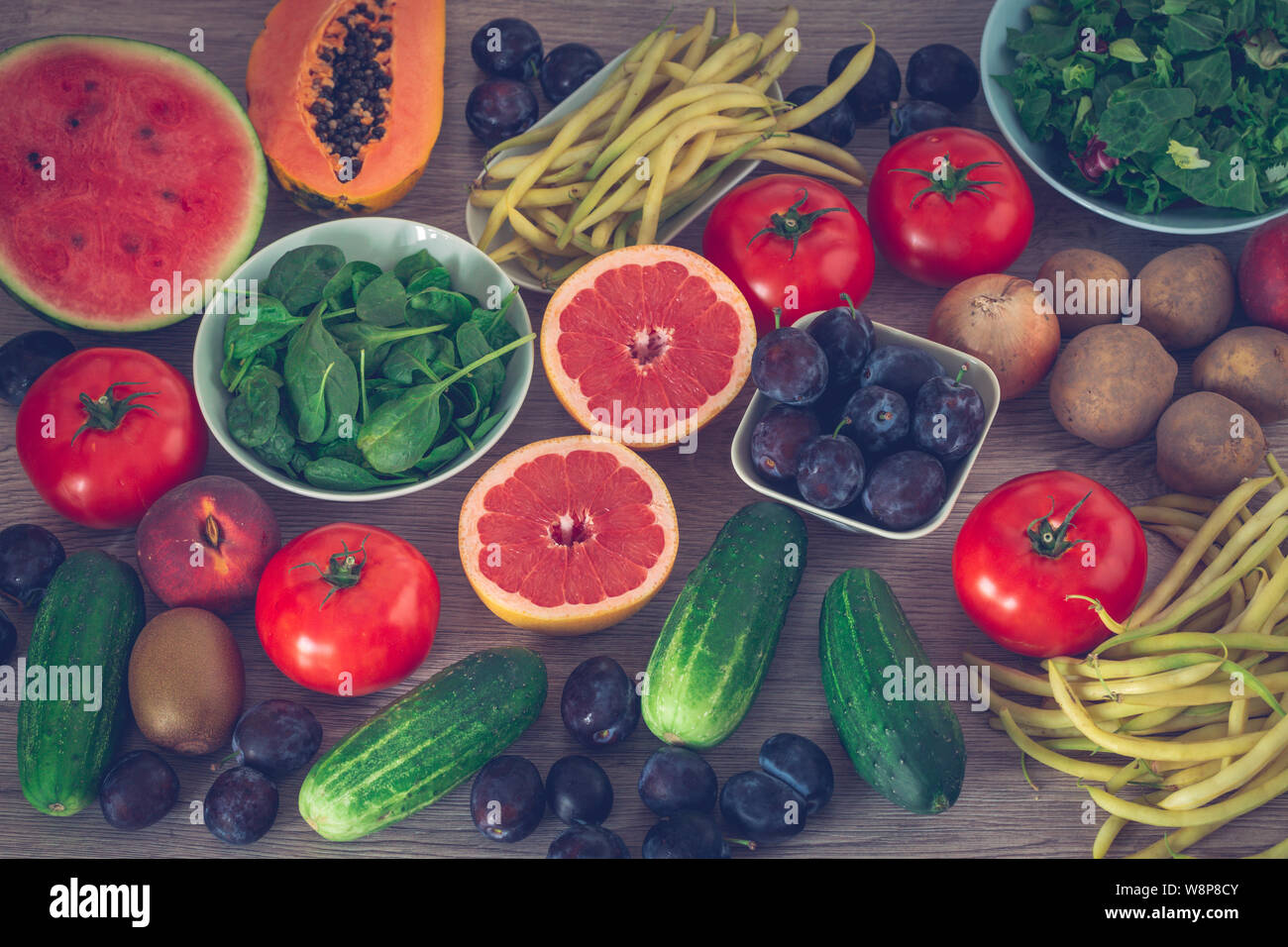 Healthy diet. Kitchen table full of fruits and vegetables Stock Photo ...