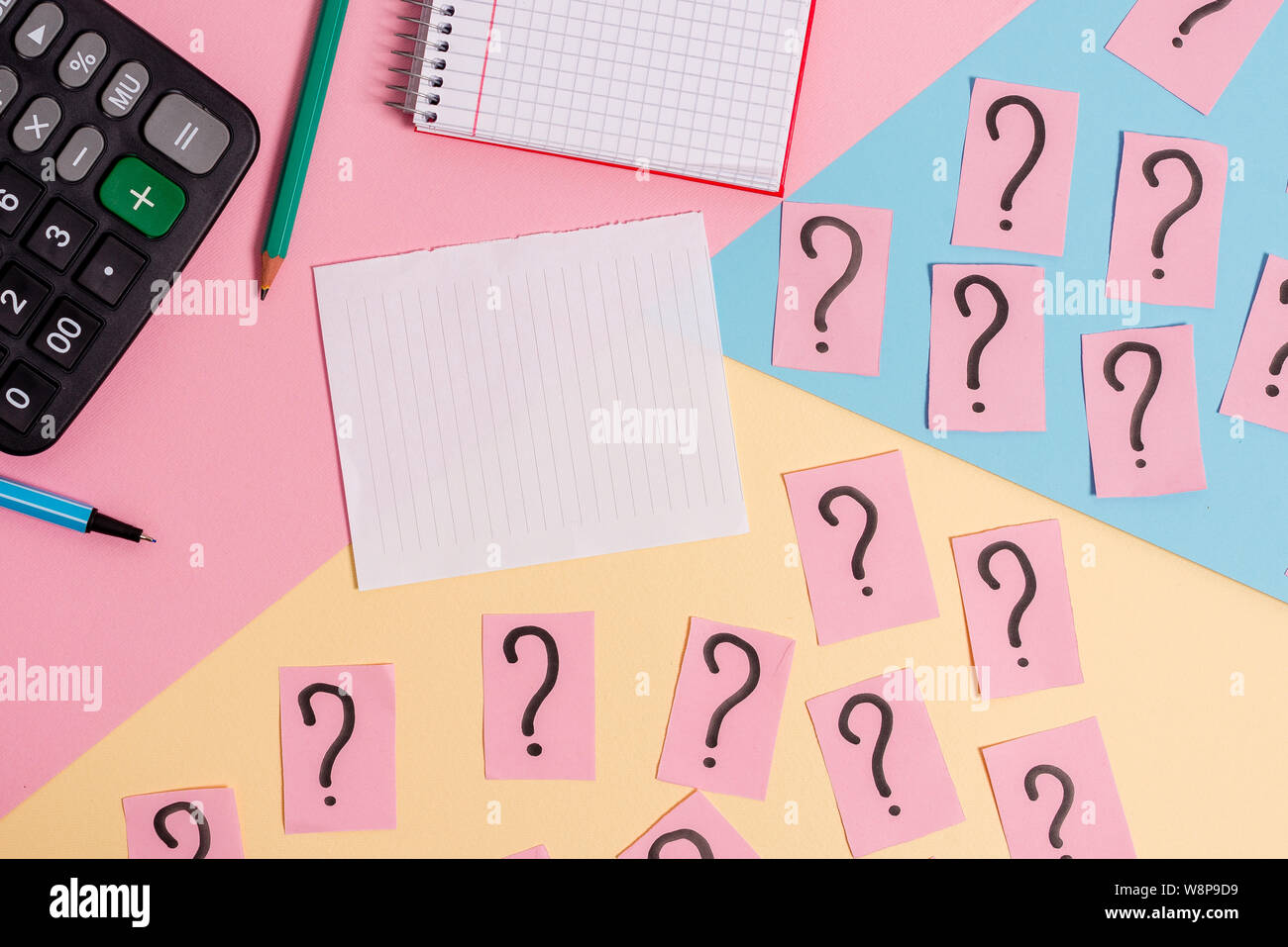 Mathematics stuff and writing equipment above pastel colours background ...