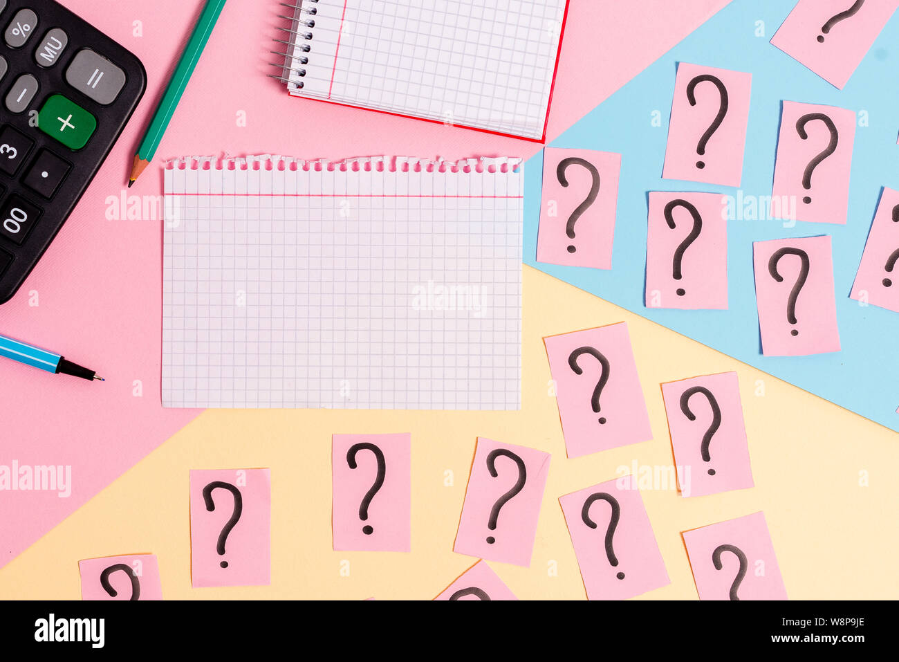 Mathematics stuff and writing equipment above pastel colours background ...