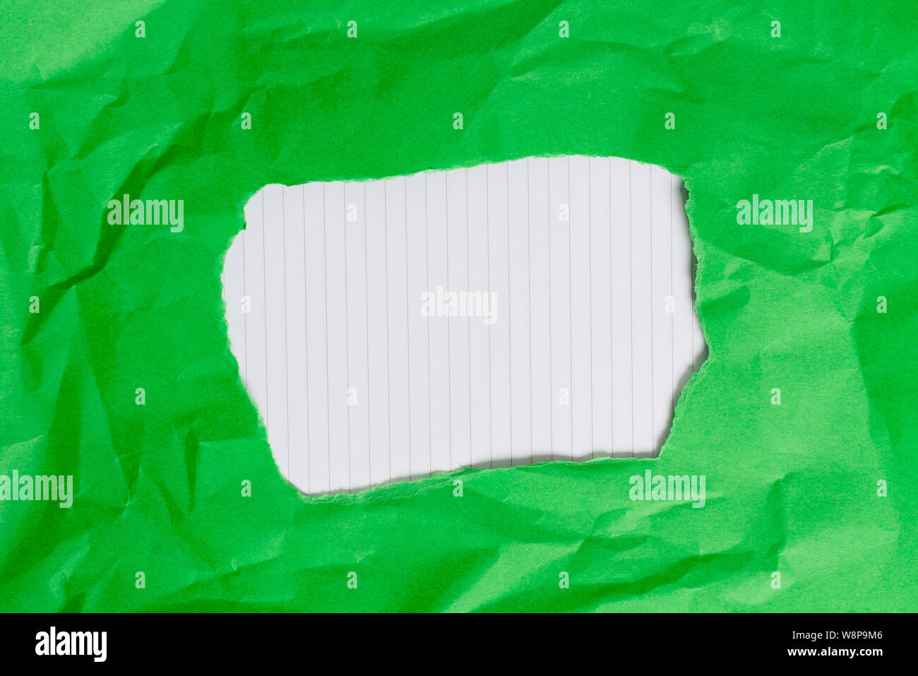 Green crumpled ripped colored paper sheet centre torn colorful ...