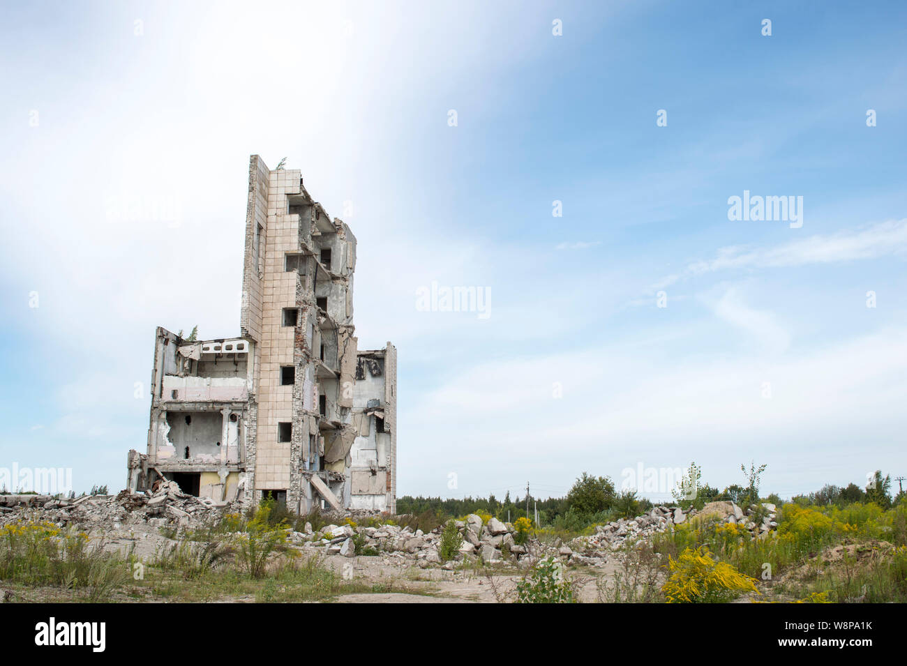 The remains of the structure of a large destroyed building with ...