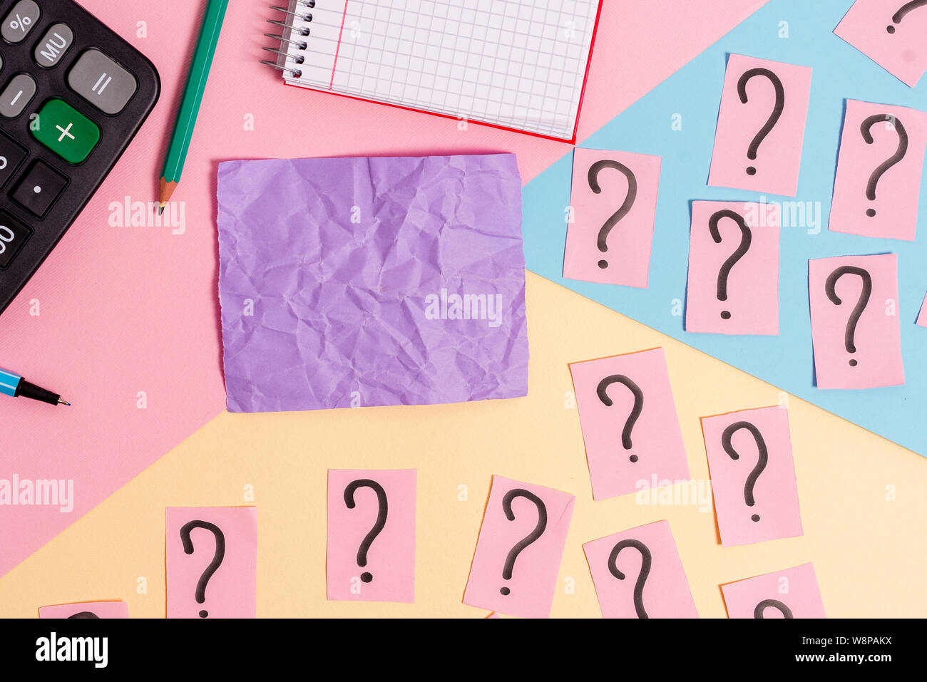 Mathematics stuff and writing equipment above pastel colours background ...