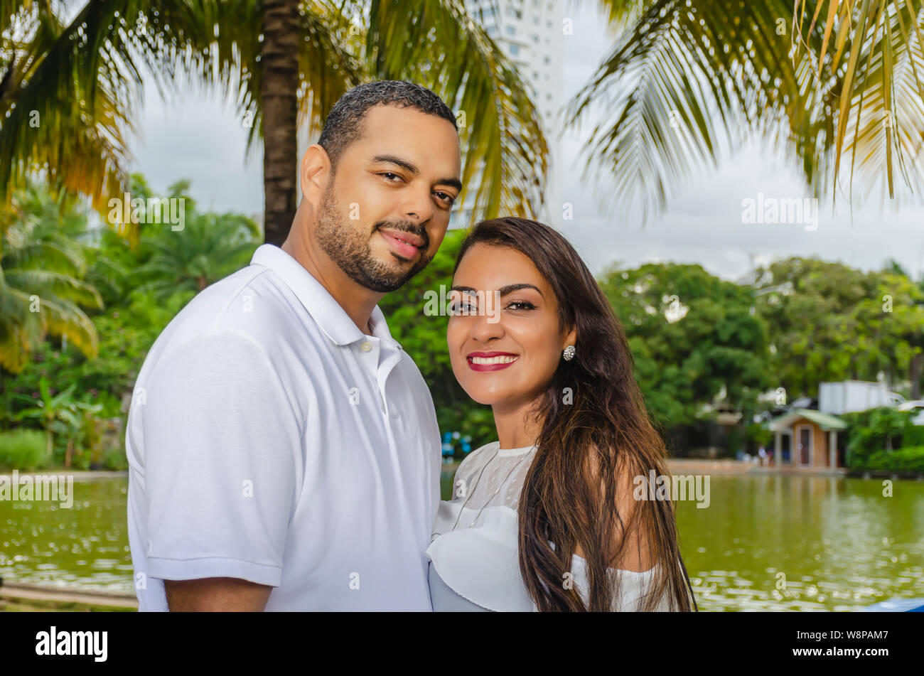 couple of young latin american men and women and happy in an outdoor ...