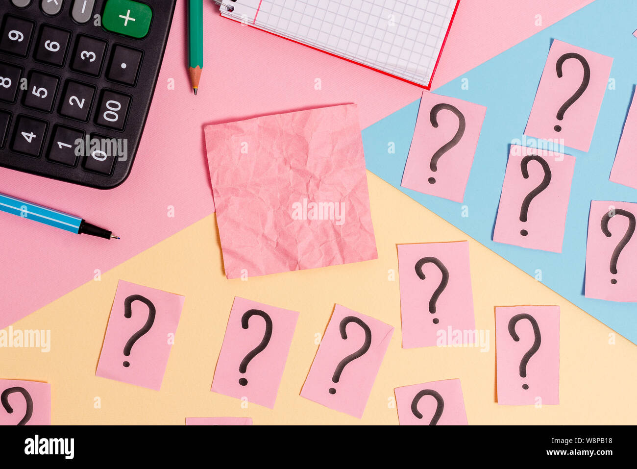 Mathematics stuff and writing equipment above pastel colours background ...