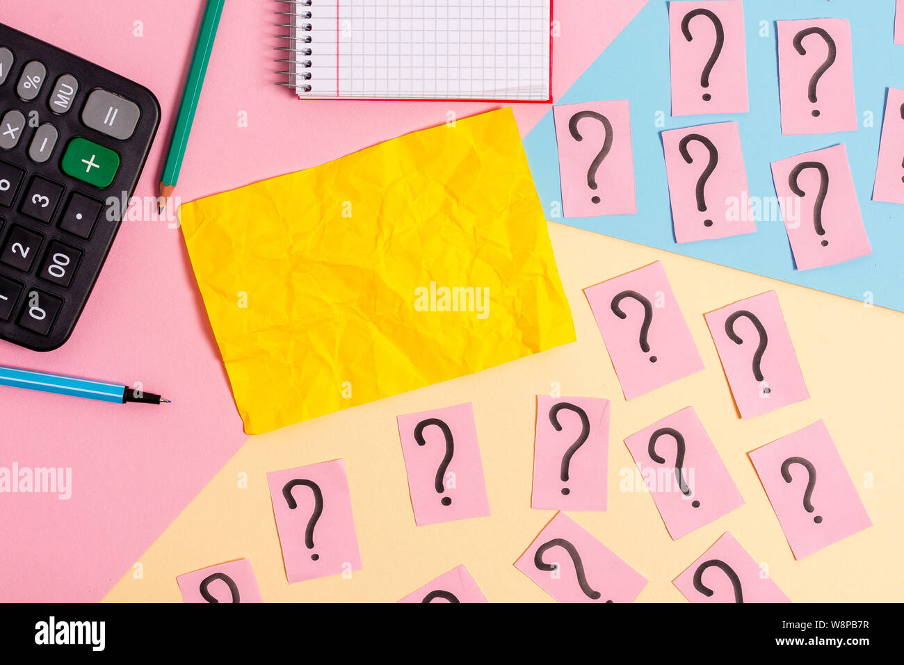 Mathematics stuff and writing equipment above pastel colours background ...