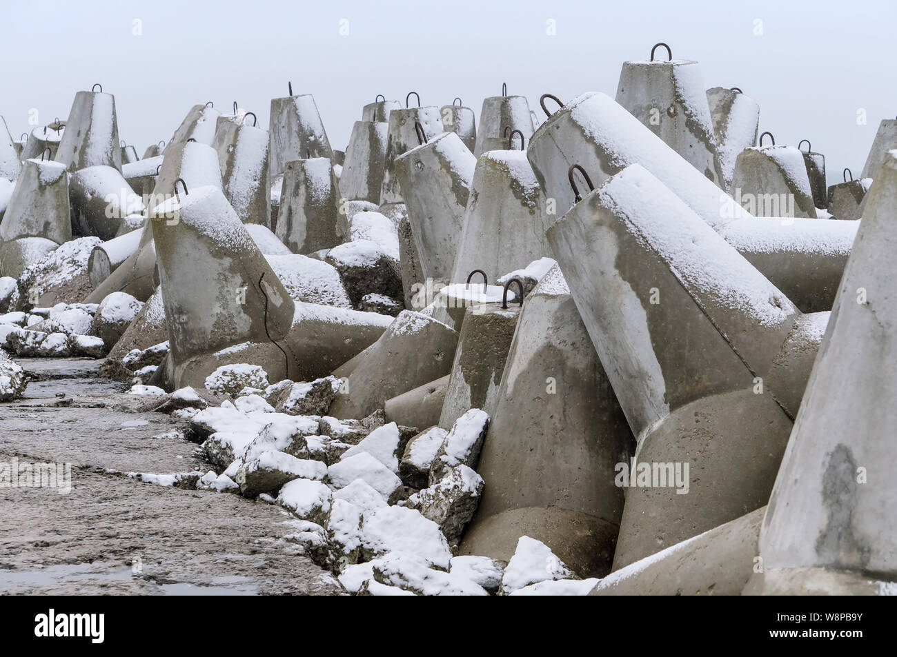 concrete breakwaters in winter, concrete coastal protection in snow ...